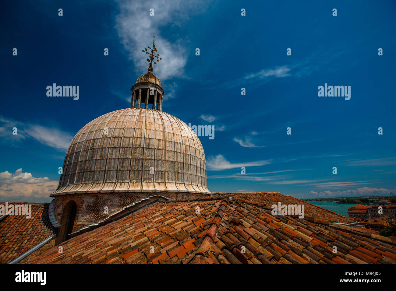 The beautiful aged dome and terracotta tiled rooftop of church Chiesa ...