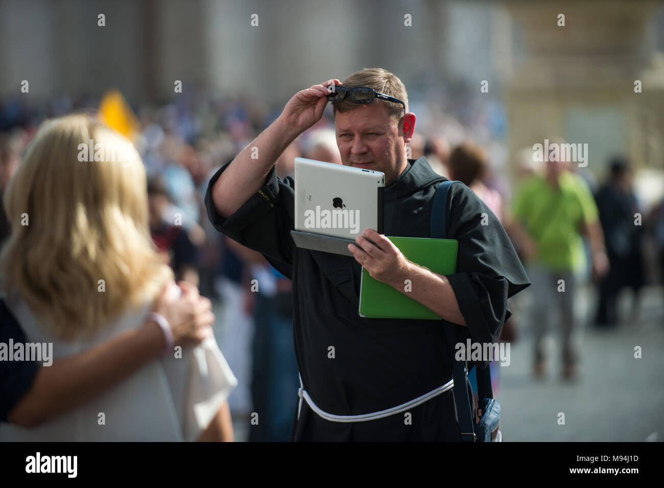 Vatican City. Priest among pilgrims at the Wednesday general audience ...