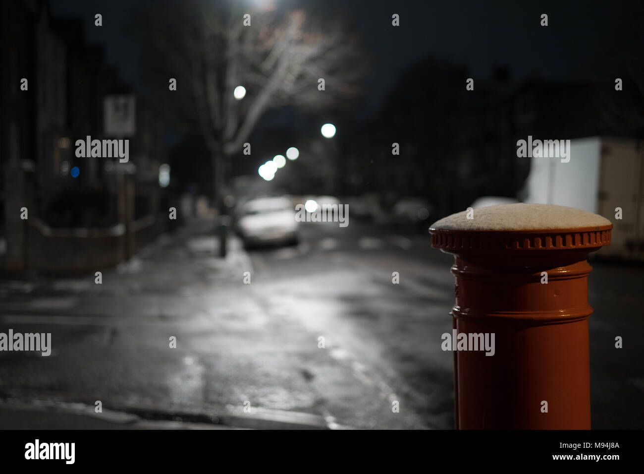 A view of a post box on a suburban street. From a series of pictures of ...