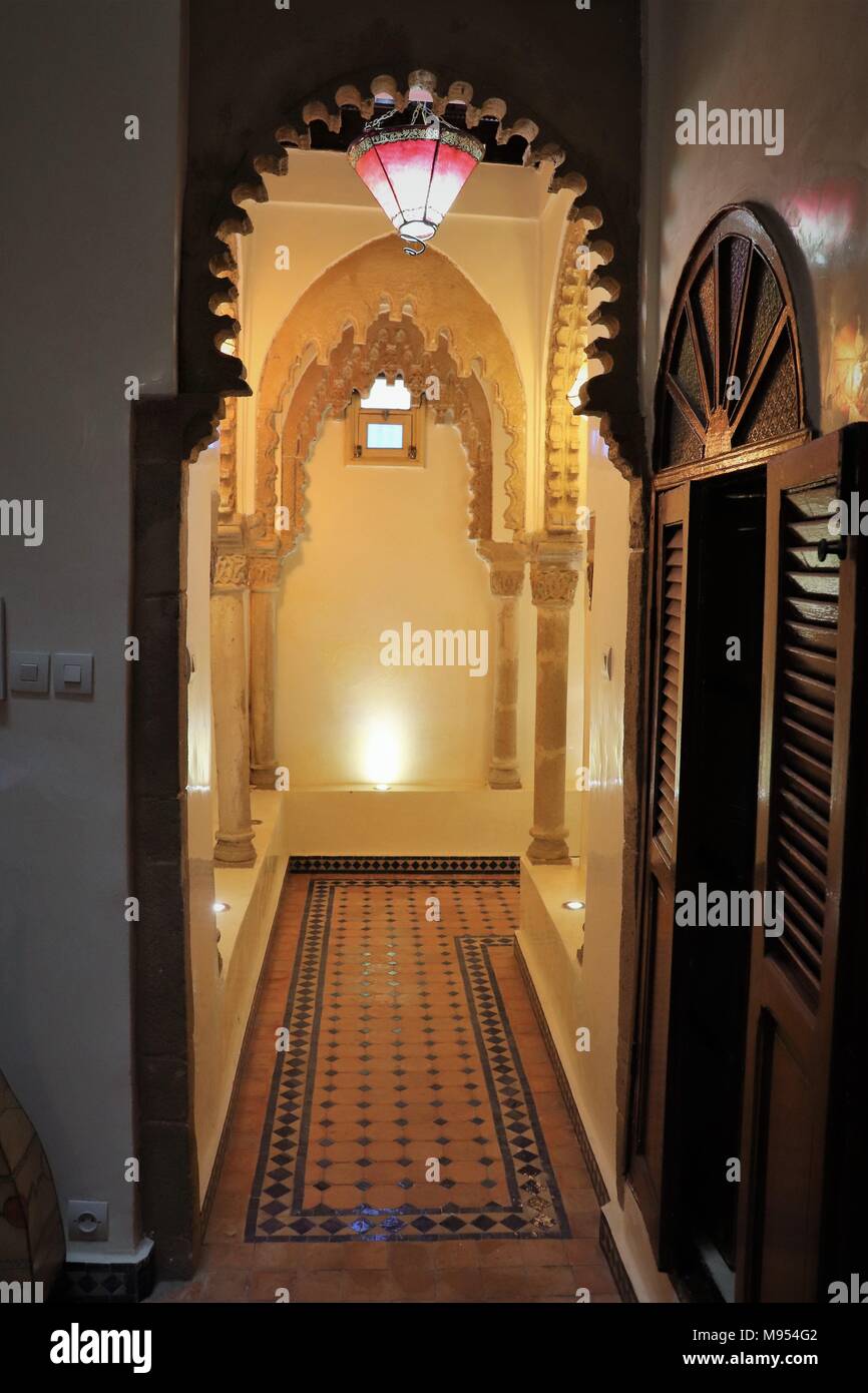 Hallway in a Moroccan Riad showing decorative floors, arches and ...