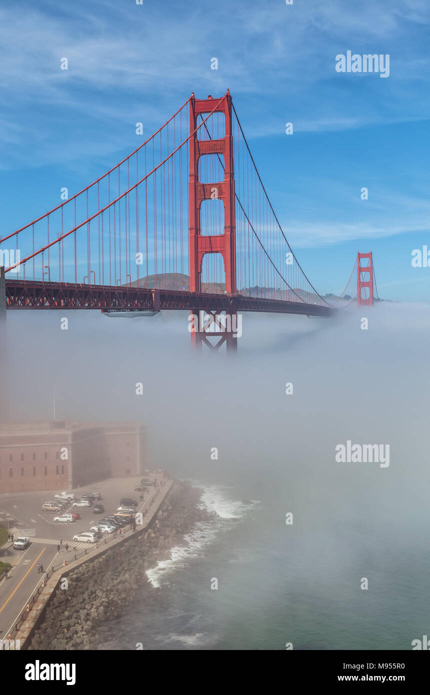 View of the Golden Gate Bridge and Fort Point with thick low fog, San ...