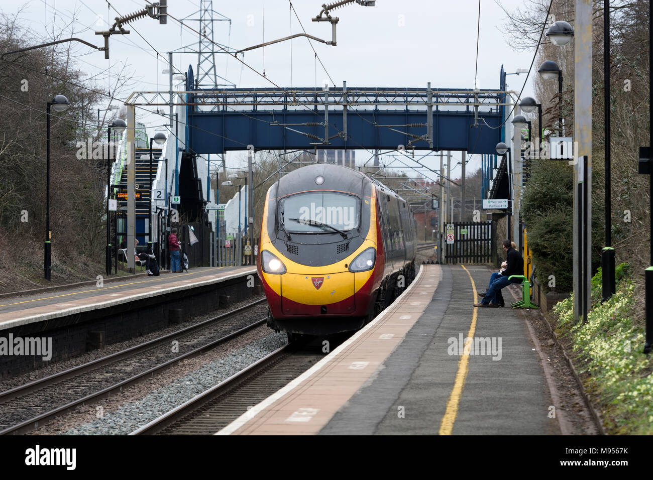 Virgin Trains Pendolino electric train passing through Canley station ...