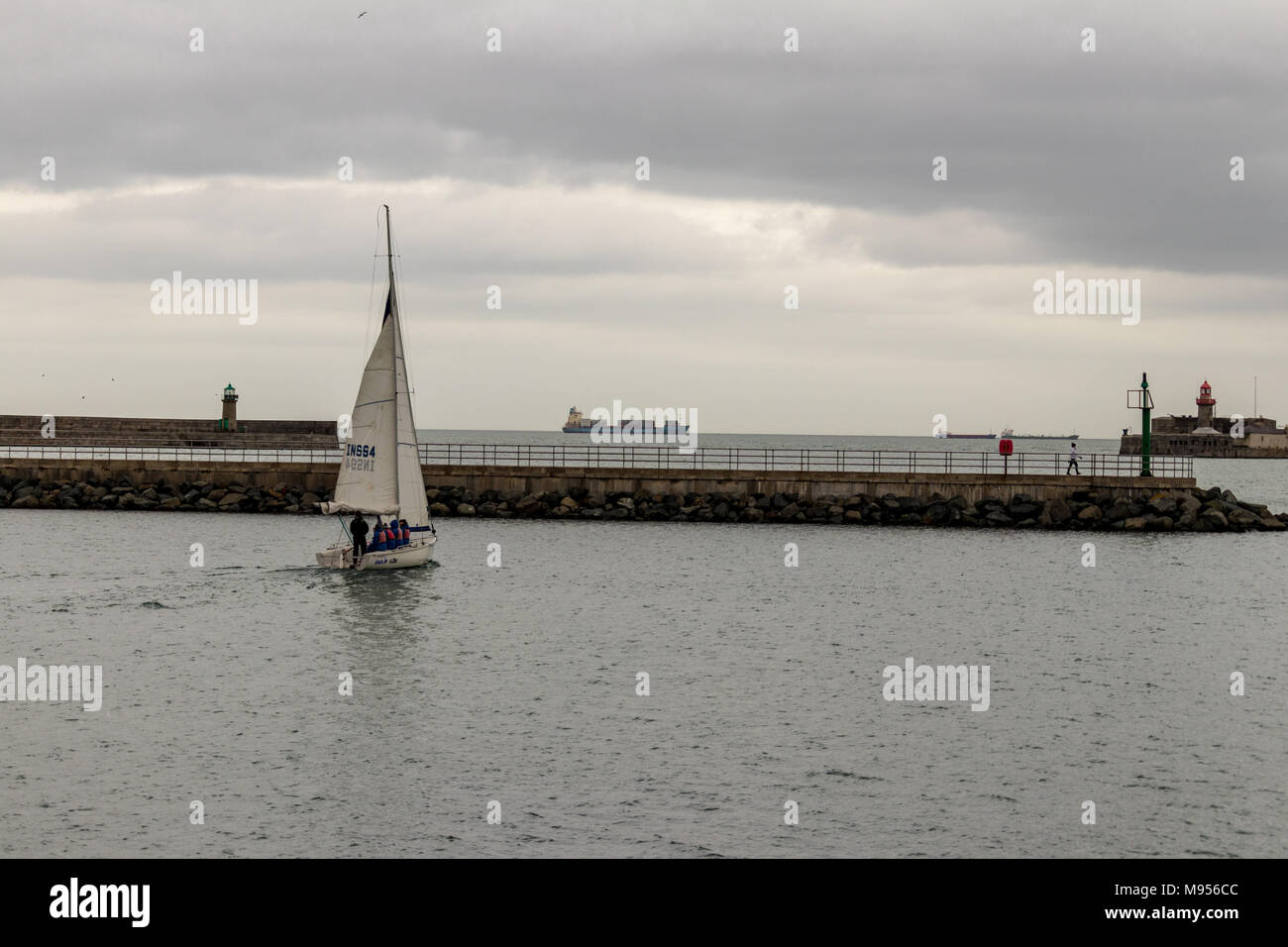A small boat sailing in Dun Laoghaire Harbour , Dublin, Ireland Stock ...
