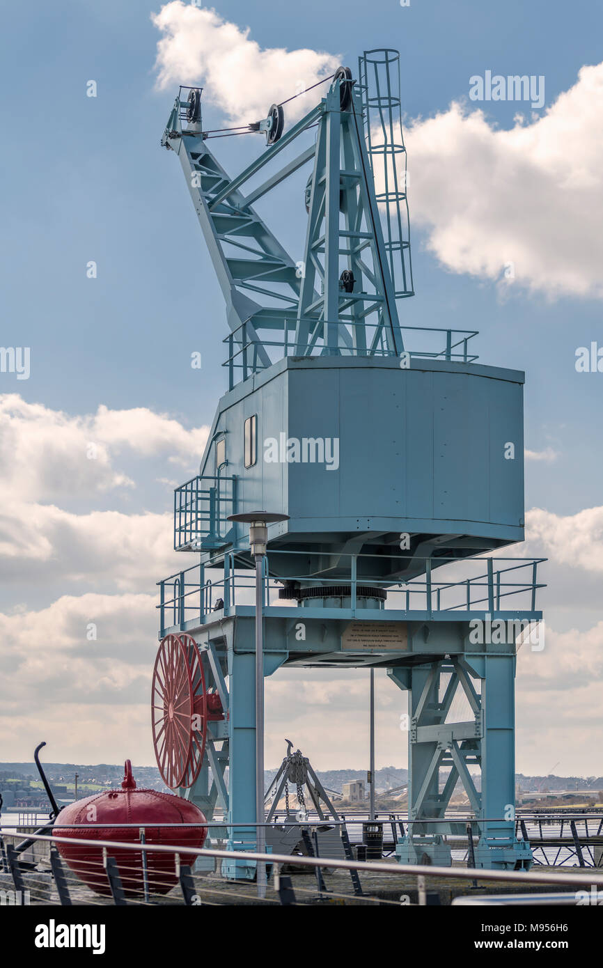 A disused dockside crane sitting on the riverside walk. St Marys island ...
