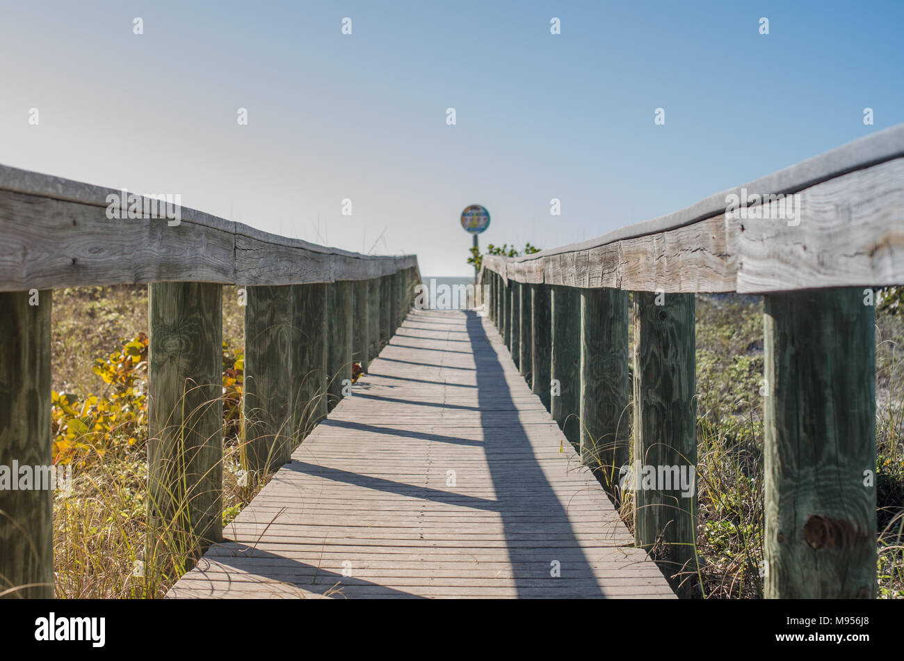 Wooden walk way leading to a St Petes's beach in florida Stock Photo ...