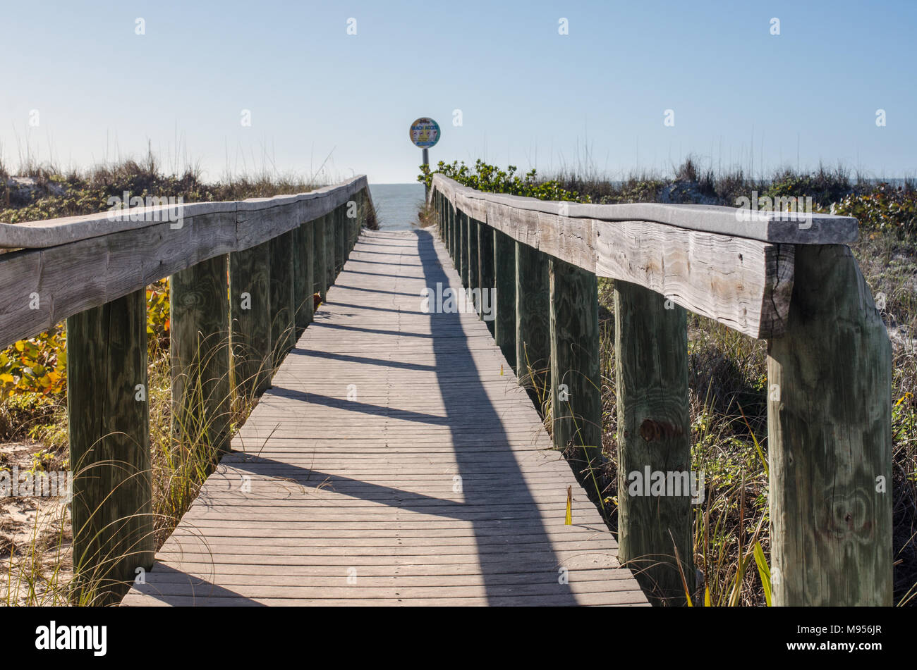 Wooden walk way leading to a St Petes's beach in florida Stock Photo ...