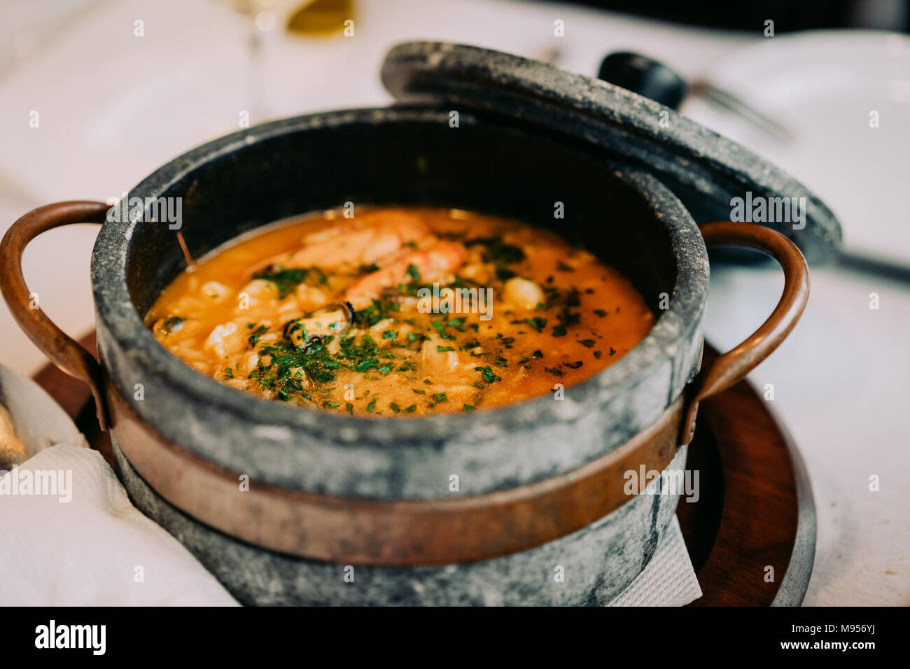 National cuisine of Cape Verde: Cachupa in traditional stone bowl Stock ...
