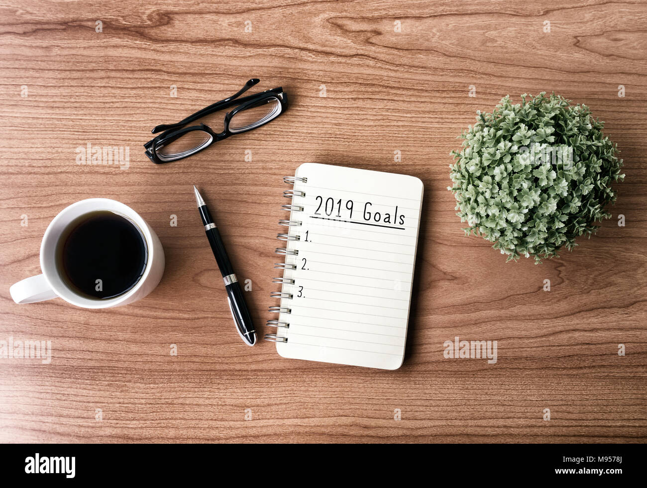 New year goals and resolution concept - 2019 goals text on notepad ...