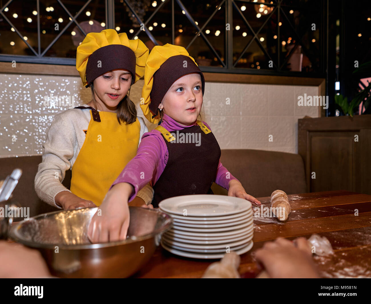 girl in the hood chef restaurant Stock Photo - Alamy