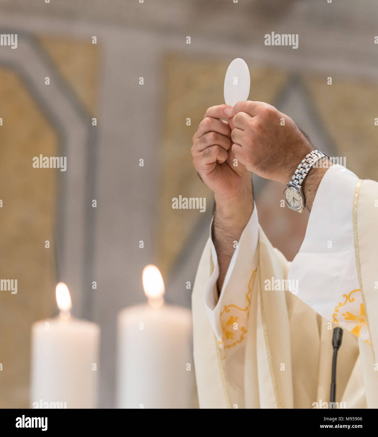 The sacred gesture during the christian mass: showing the holy bread ...