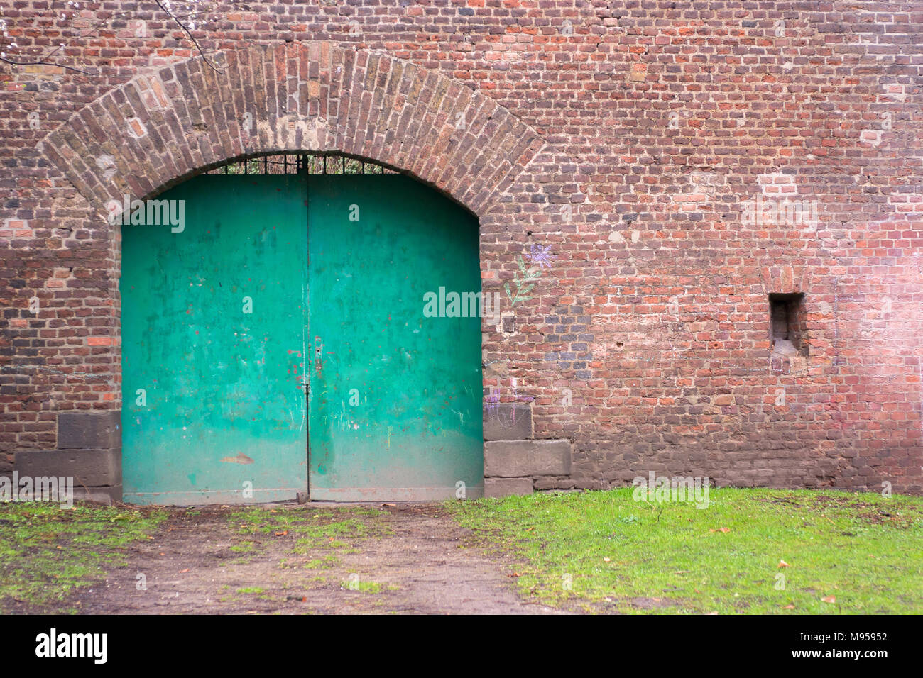 Old Green Gate and Red Brick Wall Stock Photo - Alamy