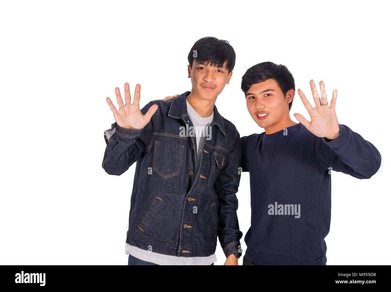 Two Thai boys show hand saying goodbye isolation Stock Photo - Alamy
