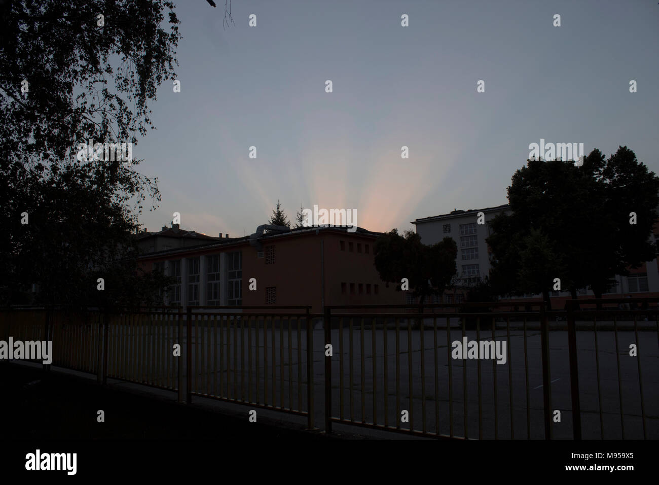 Sunset behind a school Stock Photo - Alamy