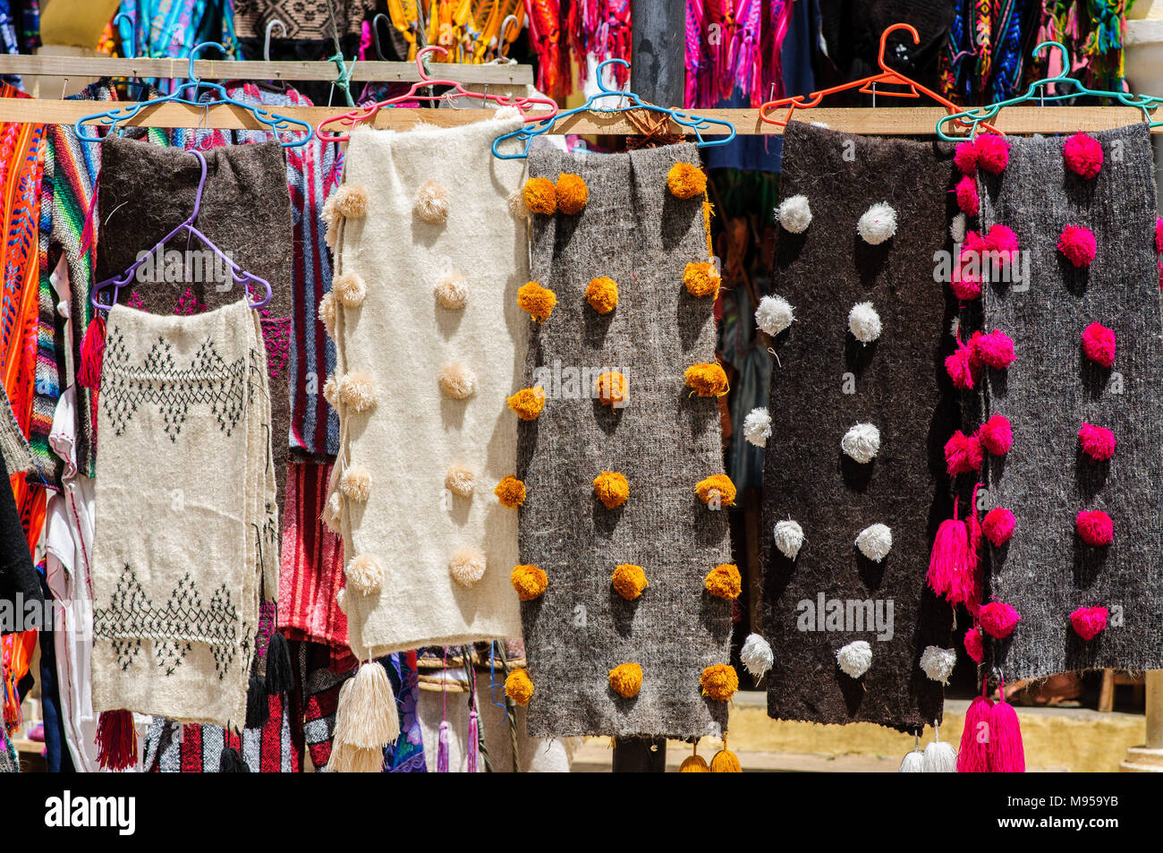 Colorful Indigenous clothes on an outdoor street market in San ...