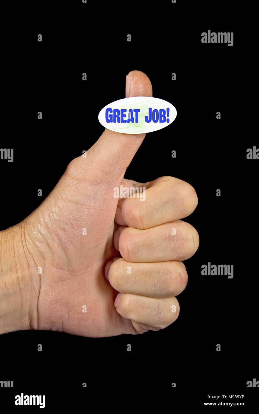 close up of great job sign on white oval sticker on man's thumbs up ...