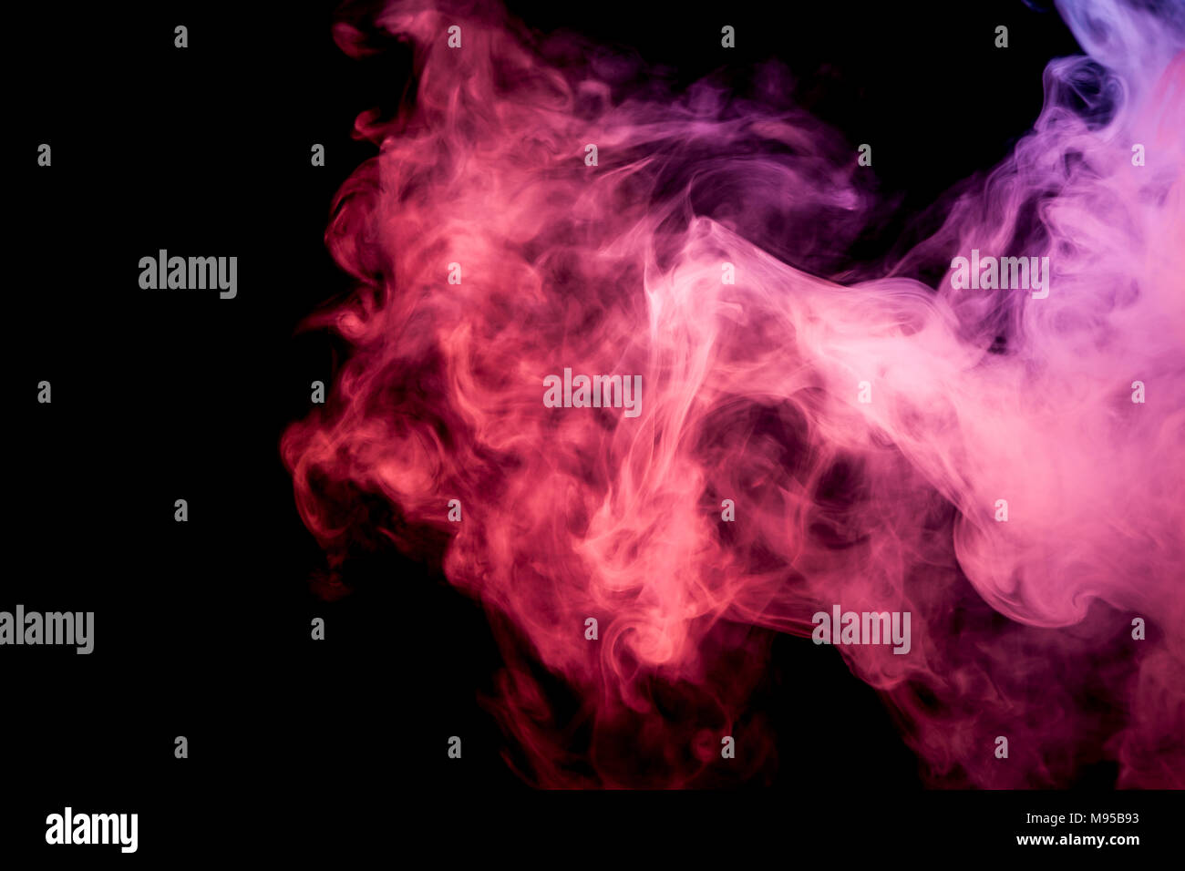 Thick red colorful smoke on a black isolated background. Background ...