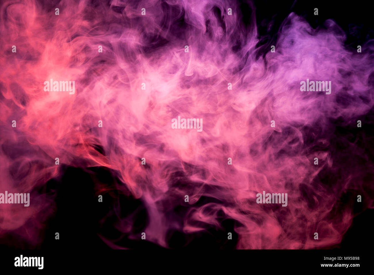 Thick red colorful smoke on a black isolated background. Background ...