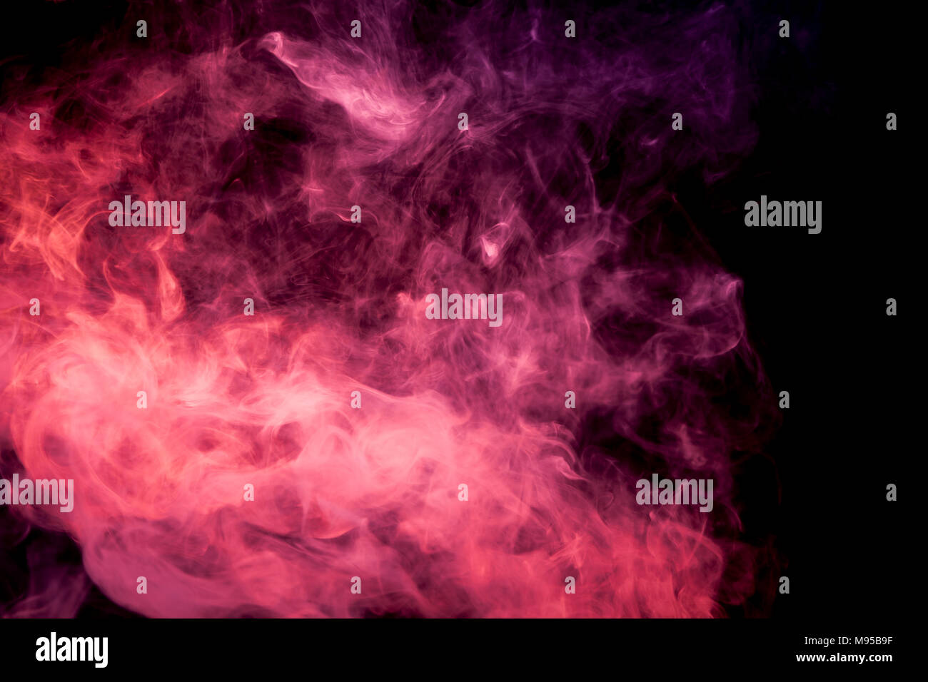 Thick red colorful smoke on a black isolated background. Background ...