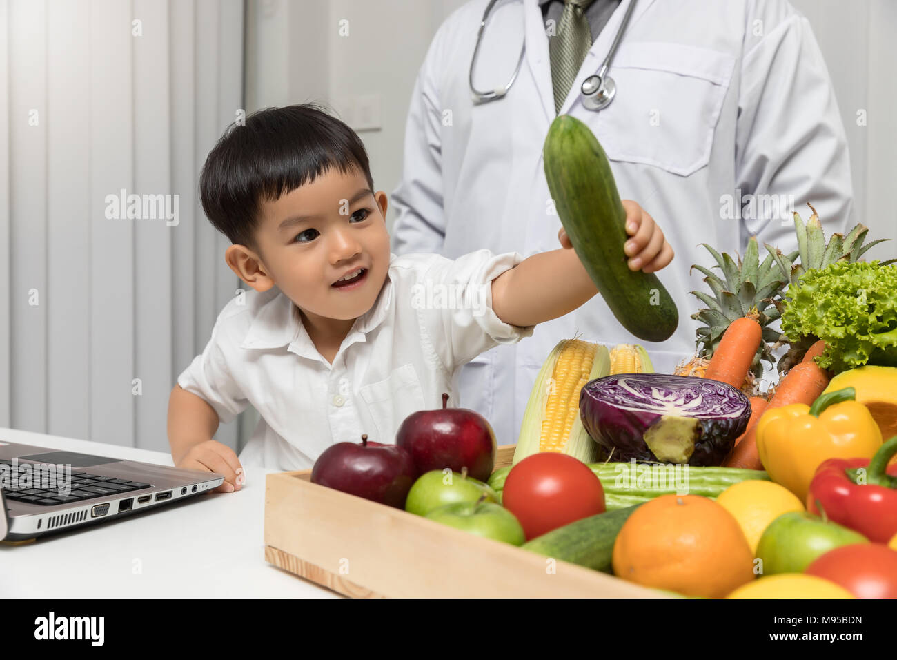 Healthy and nutrition concept. Kid learning about nutrition with doctor ...