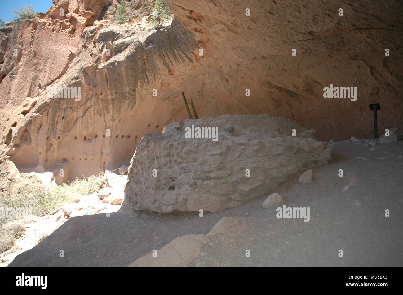 A reconstructed ceremonial kiva sits inside the Alcove House site on ...