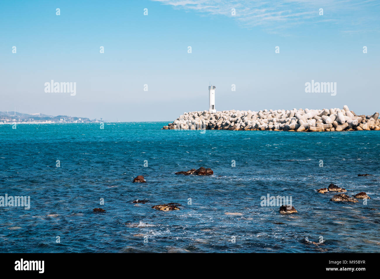 Breakwater and lighthouse at Jeongja harbor in Ulsan, Korea Stock Photo ...