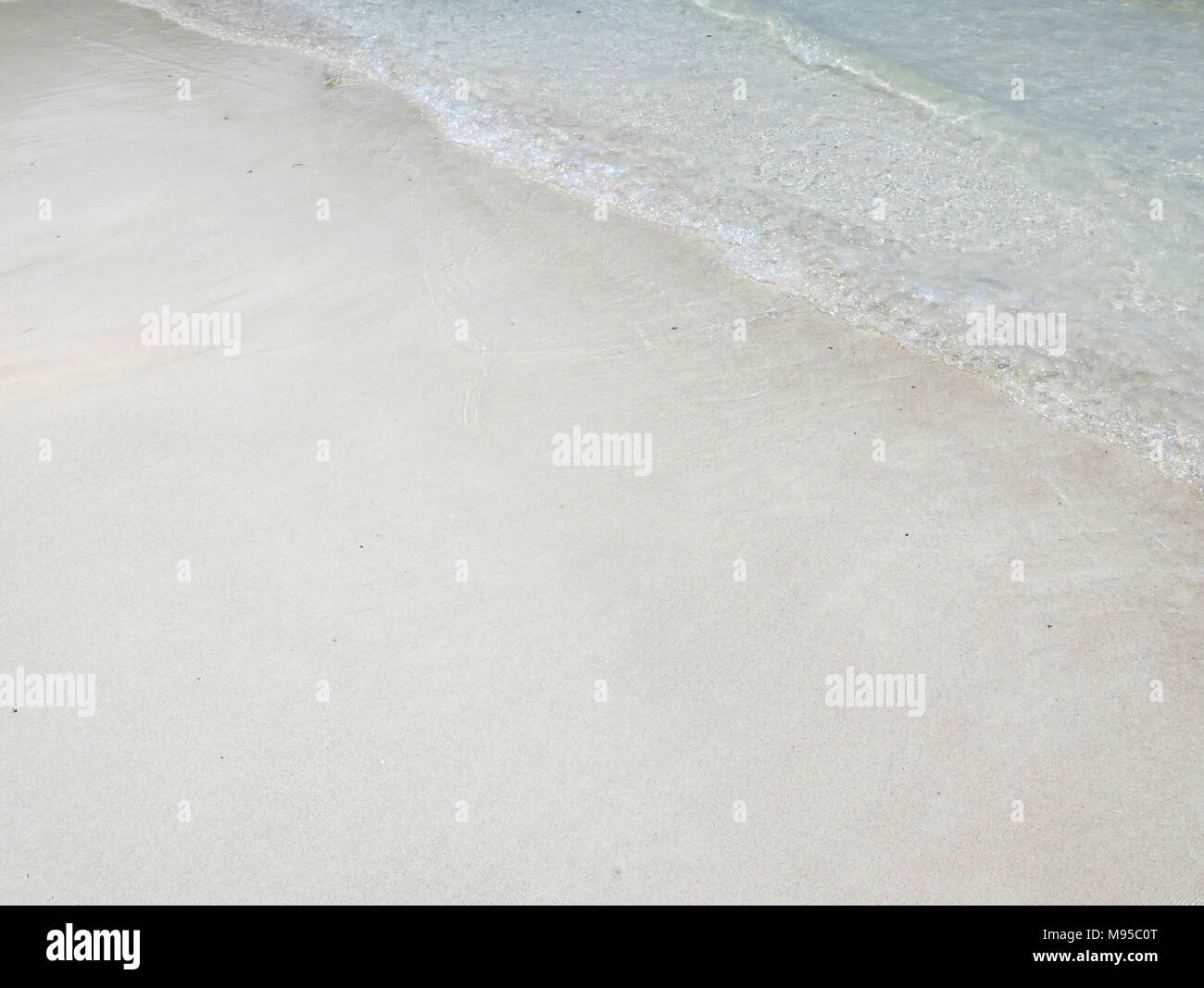 Beautiful tropical beach, waves on white sand Stock Photo - Alamy