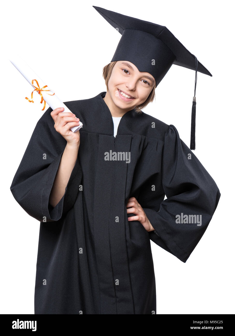 Portrait of graduate little girl student in black graduation gown with ...