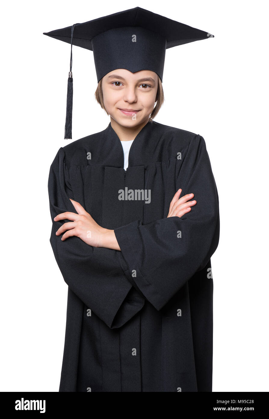 Portrait of graduate little girl student in black graduation gown with ...