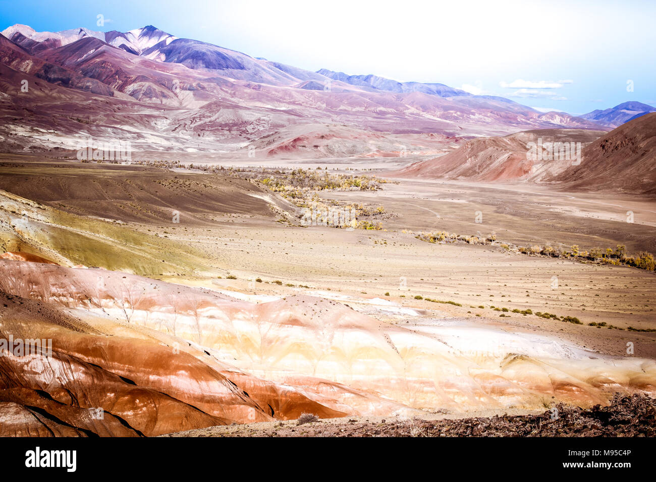 Colorful pink hills under the Sunny sky. Rocks and mountains of pastel ...