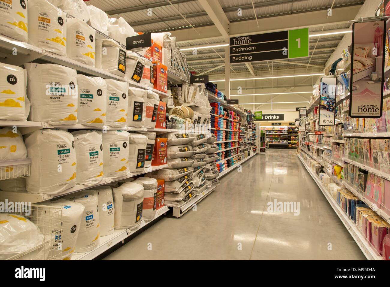 Bathroom and bedding products for sale on full shelves in an Asda ...