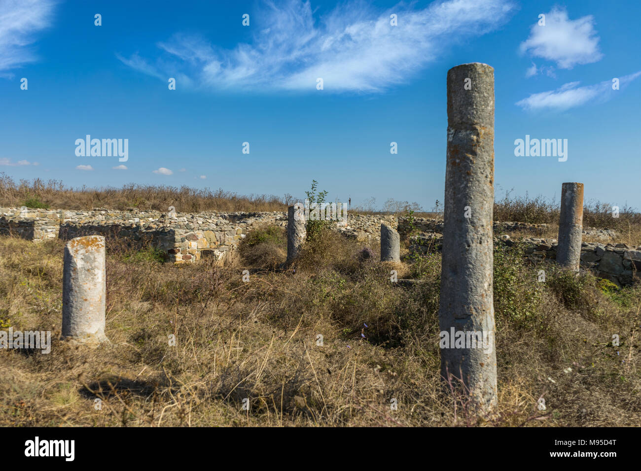 ruins of stone walls and columns of ancient castle Histria, Romania ...