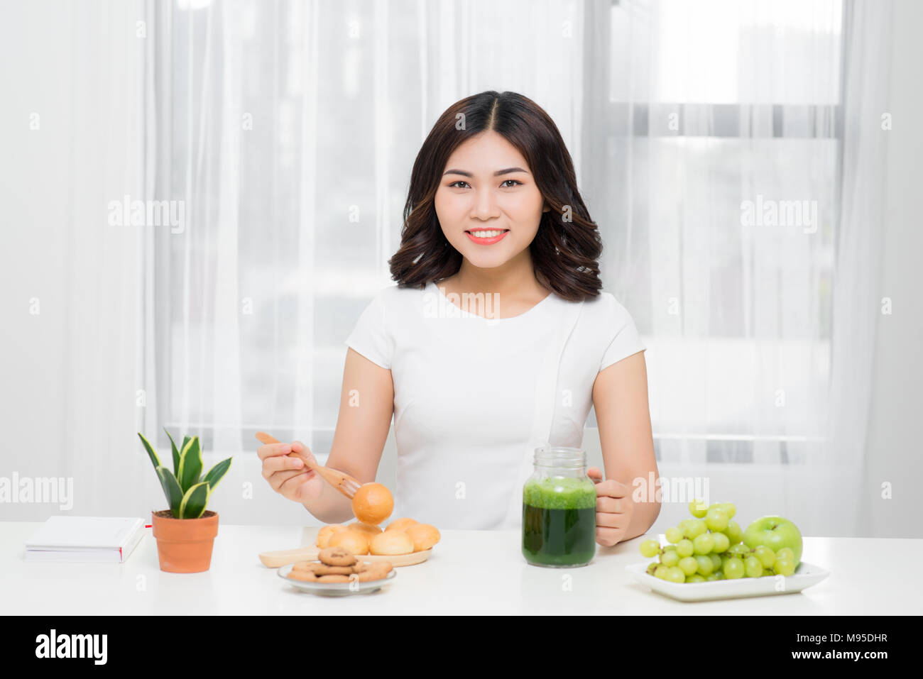 Healthy Meal. Happy Beautiful Smiling Woman Drinking Green Detox Vegetable Smoothie. Healthy ...