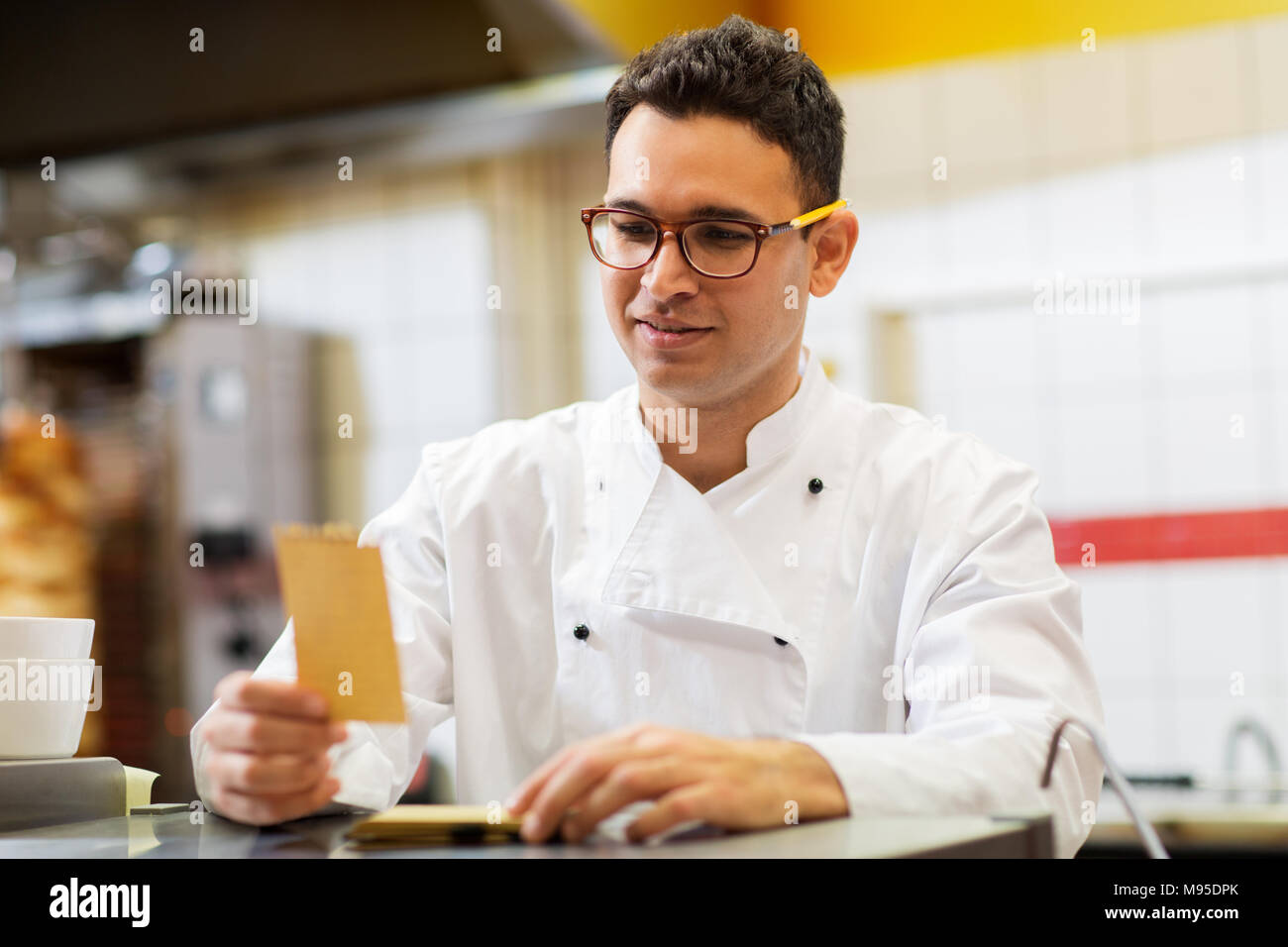 chef at kebab shop with order or paper note Stock Photo - Alamy