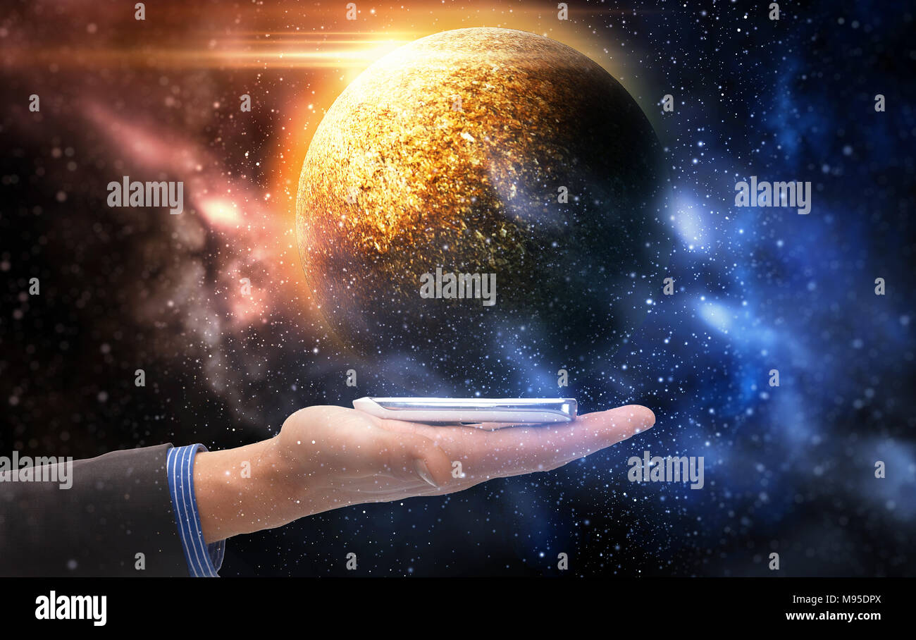 hand holding smartphone over planet in space Stock Photo - Alamy