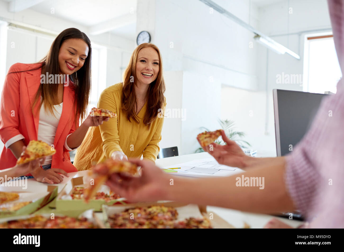Group business people eating pizza hi-res stock photography and images ...