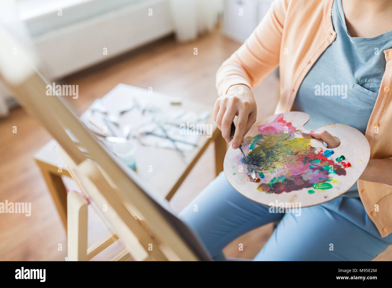artist with palette knife painting at art studio Stock Photo - Alamy