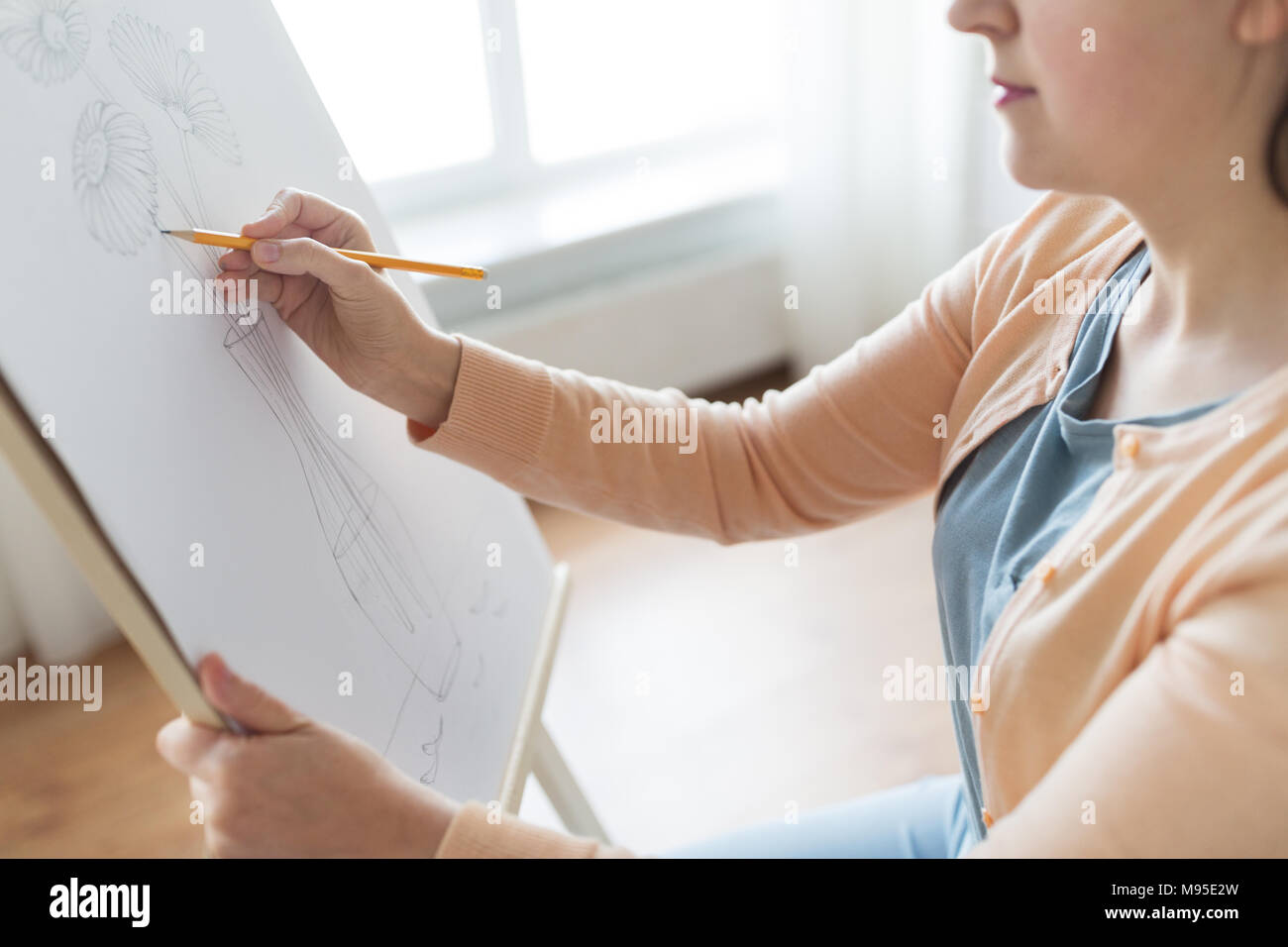 artist with pencil drawing picture at art studio Stock Photo - Alamy