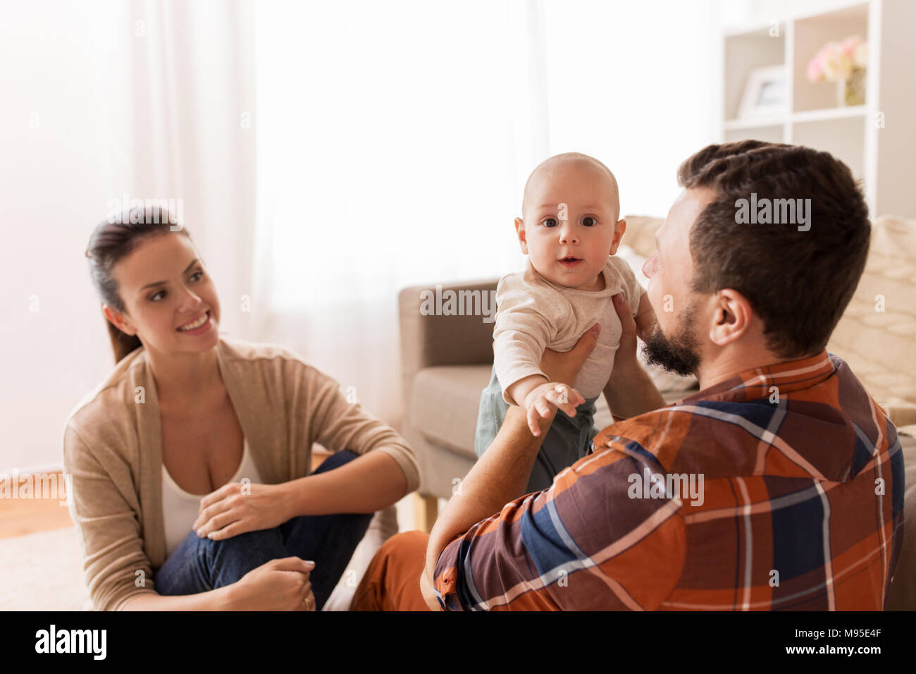 happy family with baby at home Stock Photo - Alamy