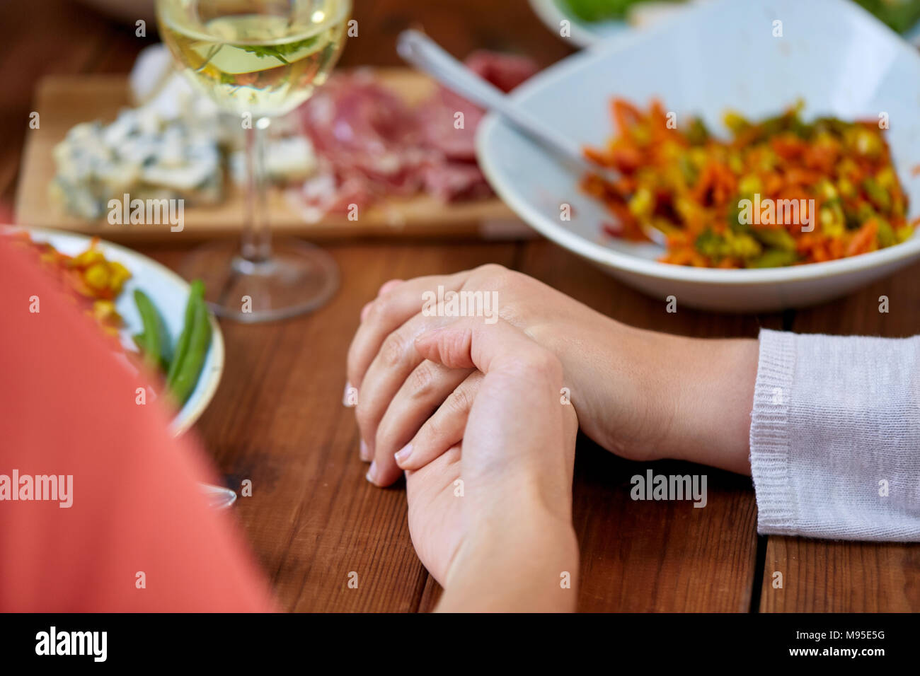 hands of people at table praying before meal Stock Photo - Alamy