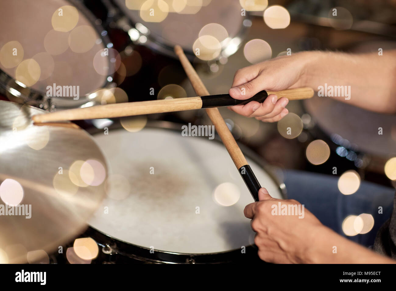 male musician hands with drumsticks at concert Stock Photo - Alamy