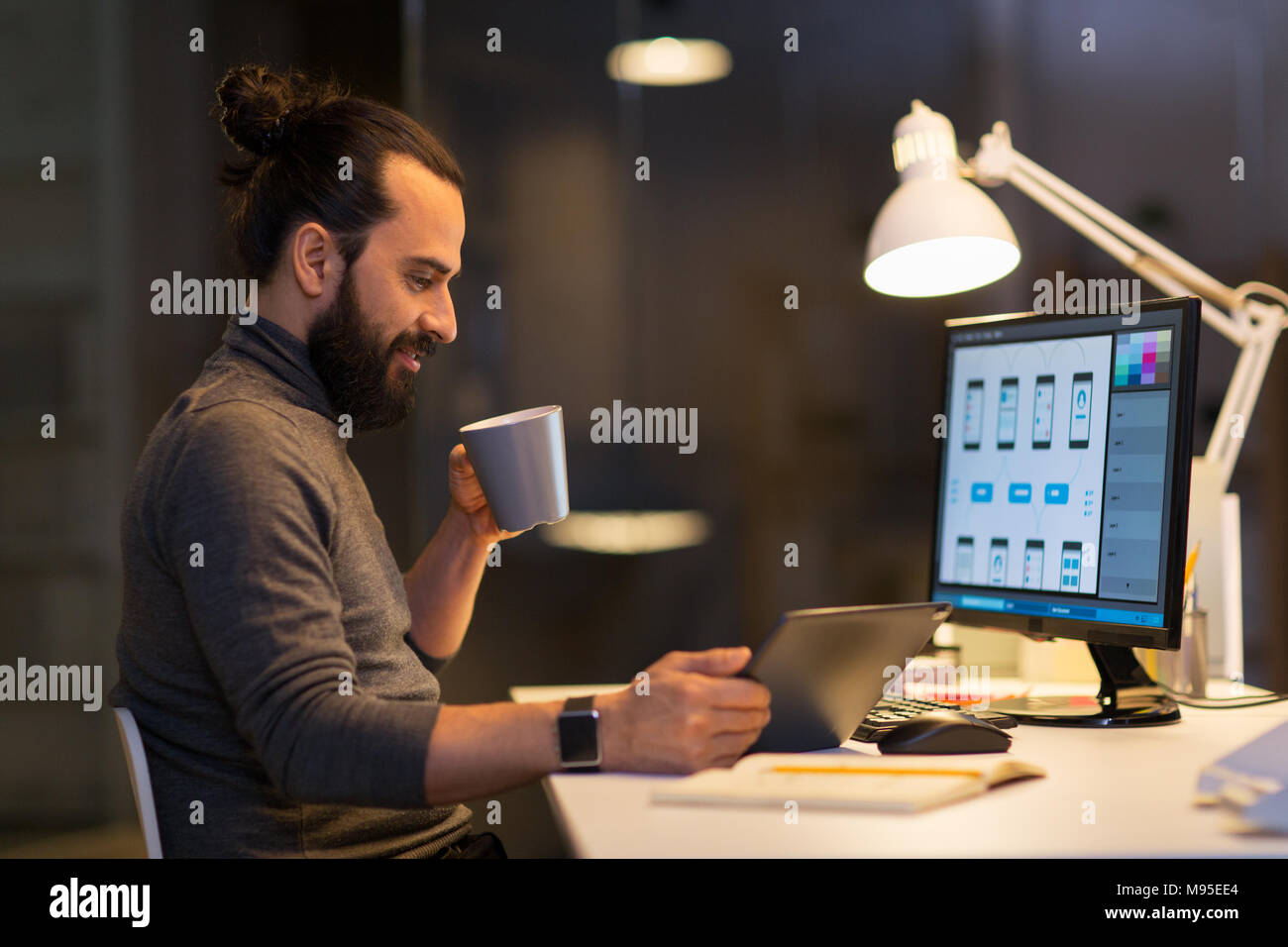 creative man with computer working late at office Stock Photo - Alamy