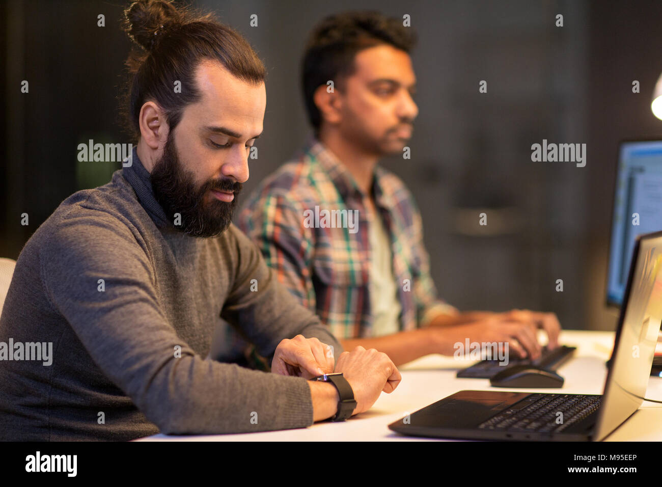 creative man with smartwatch working at office Stock Photo - Alamy