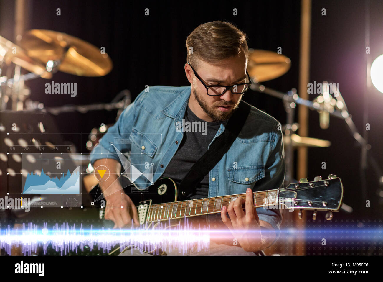 guitarist playing guitar at sound recording studio Stock Photo - Alamy