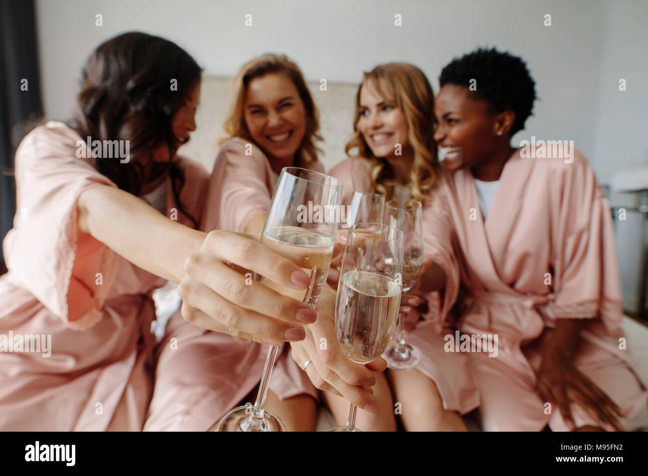 Women celebrate a bachelorette party of bride. Group of female sitting ...