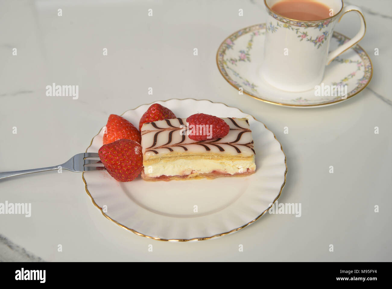 British afternoon tea with cream slice cake and strawberries Stock ...