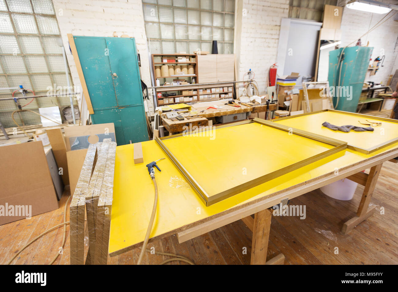 glue gun and frame on workbench at workshop Stock Photo - Alamy