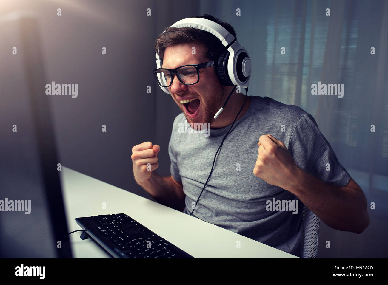 Excited man playing video game hi-res stock photography and images - Alamy