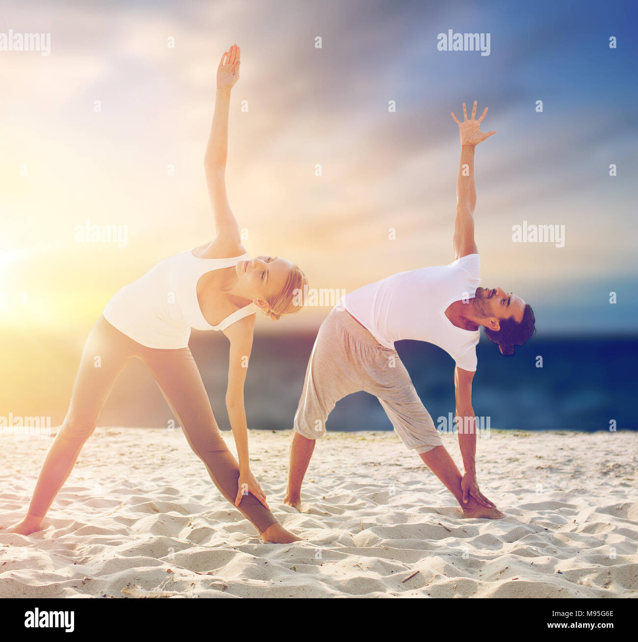 Yoga class on the beach hi-res stock photography and images - Alamy