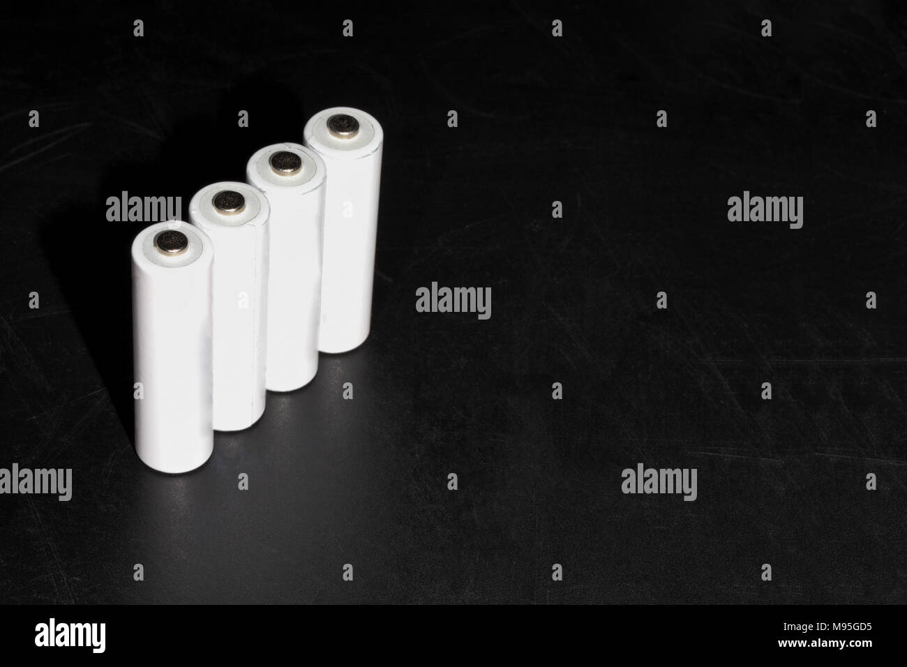 white batteries on the board, background image with space for text ...