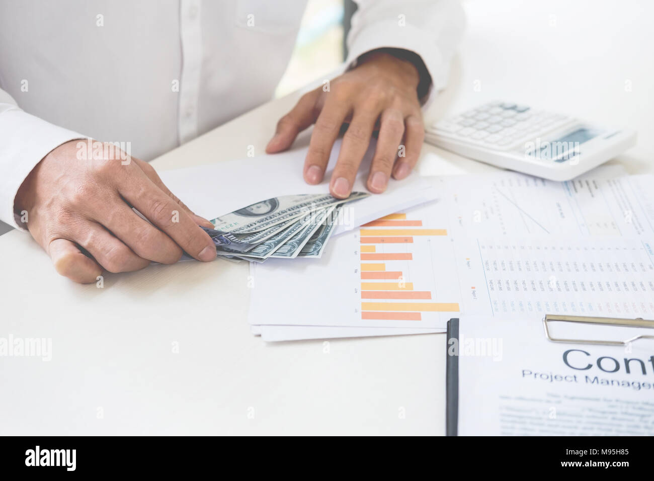 business man counting money at the table accounting concept Stock Photo ...